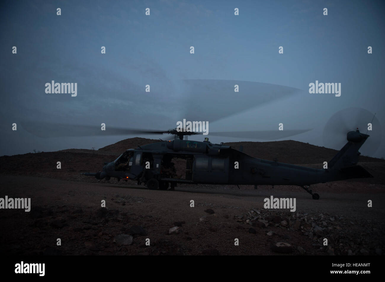 A UH-60 flown by the 303rd Expeditionary Rescue Squadron waits for take ...
