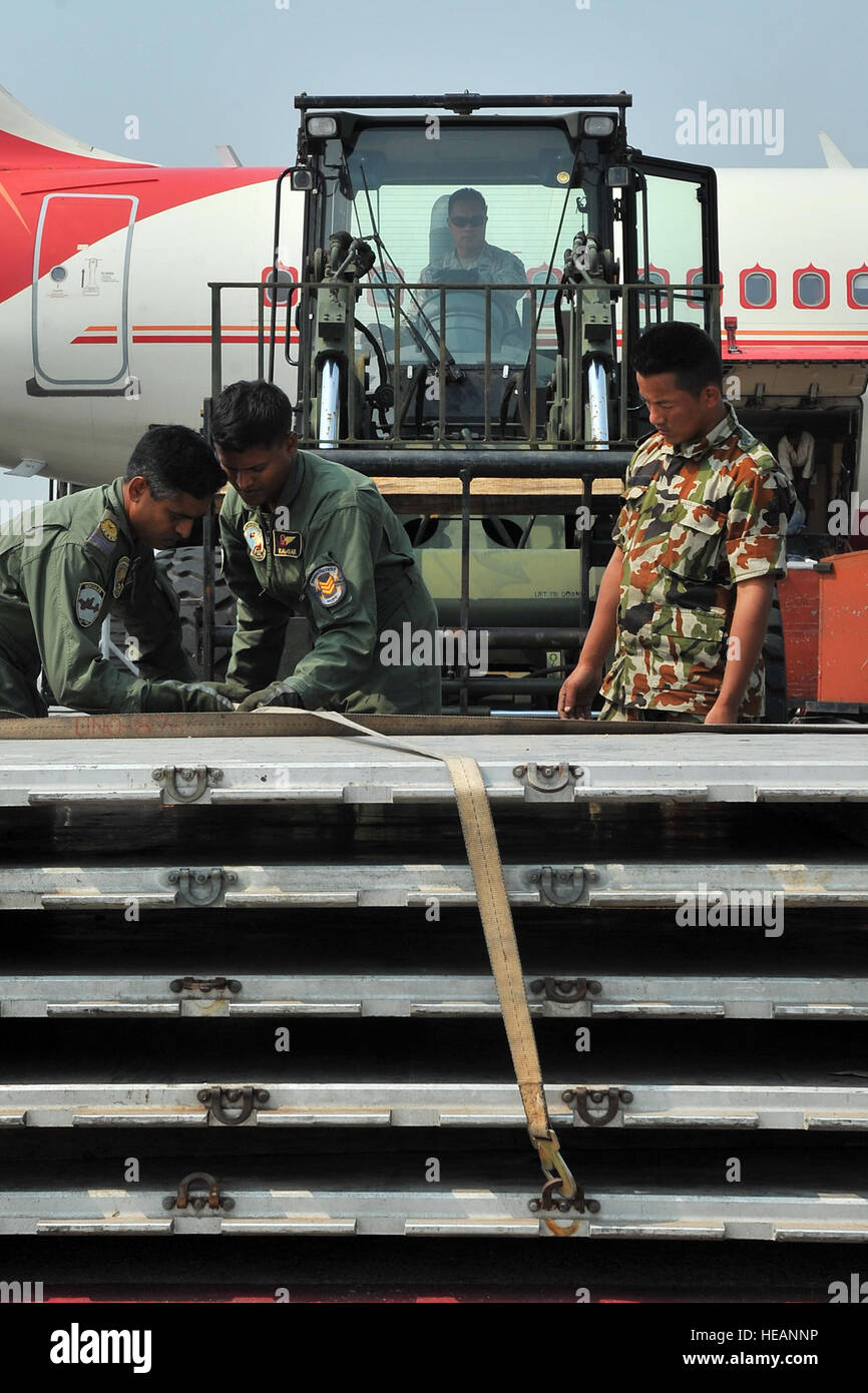 Bangladesh Air Force and Nepalese Army members secure aircraft pallets ...