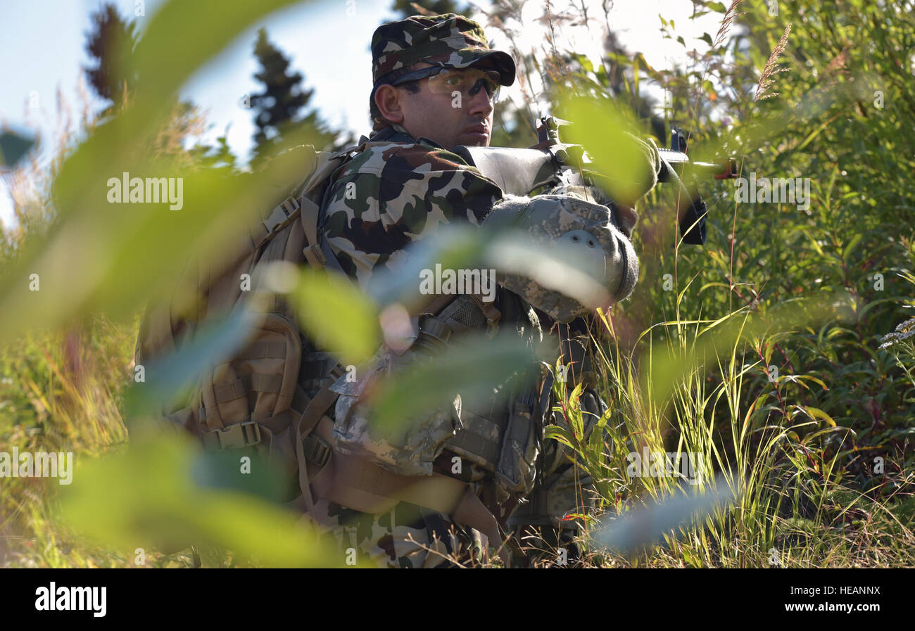 A Nepalese Army Ranger pulls security for his squad of U.S. Army ...