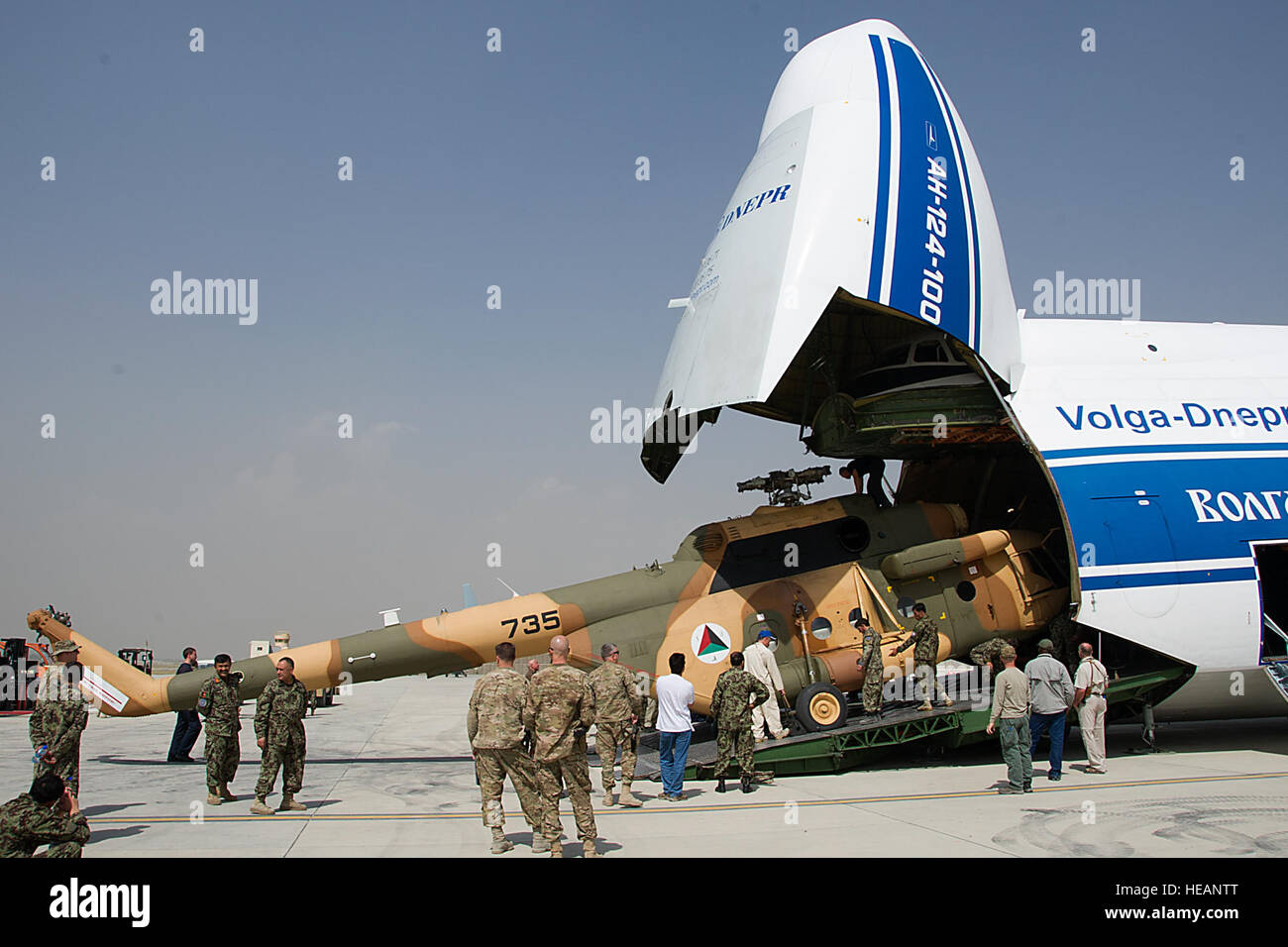 Afghan air force soldiers work together to move an Mi-17 out of a ...