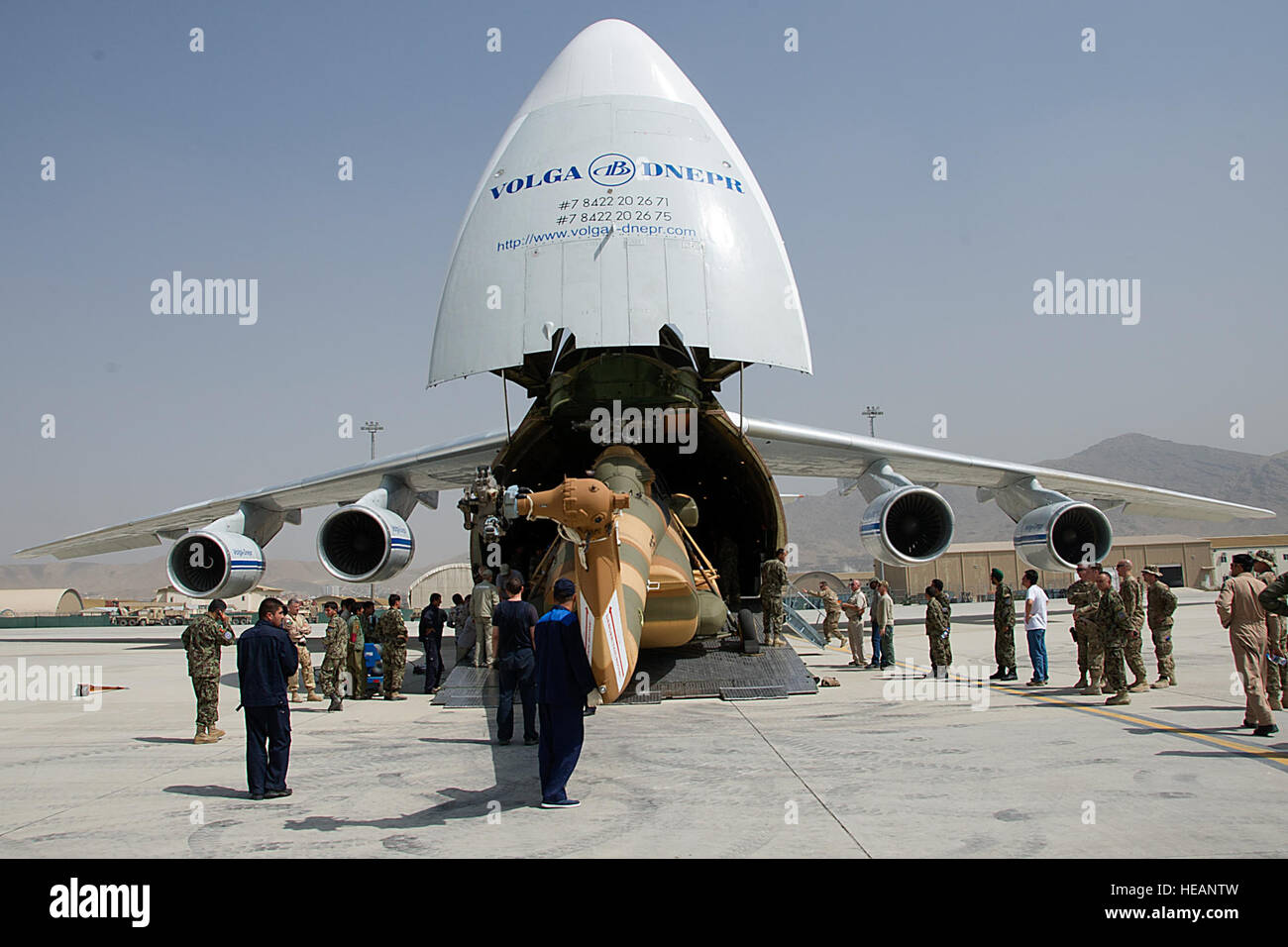 Afghan air force soldiers work together to move an Mi-17 out of a ...
