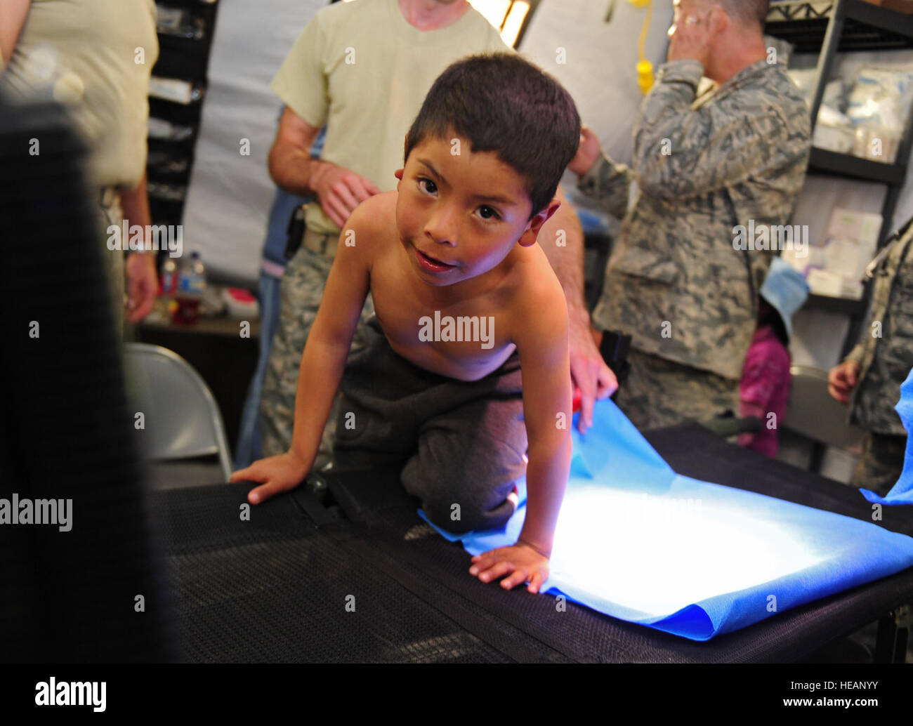 A Peruvian boy jumps on an operating table to get a cyst removed from ...