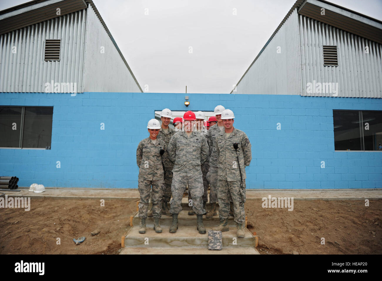 U.S. Air Force Col. Douglas Hardman takes a picture with airmen ...