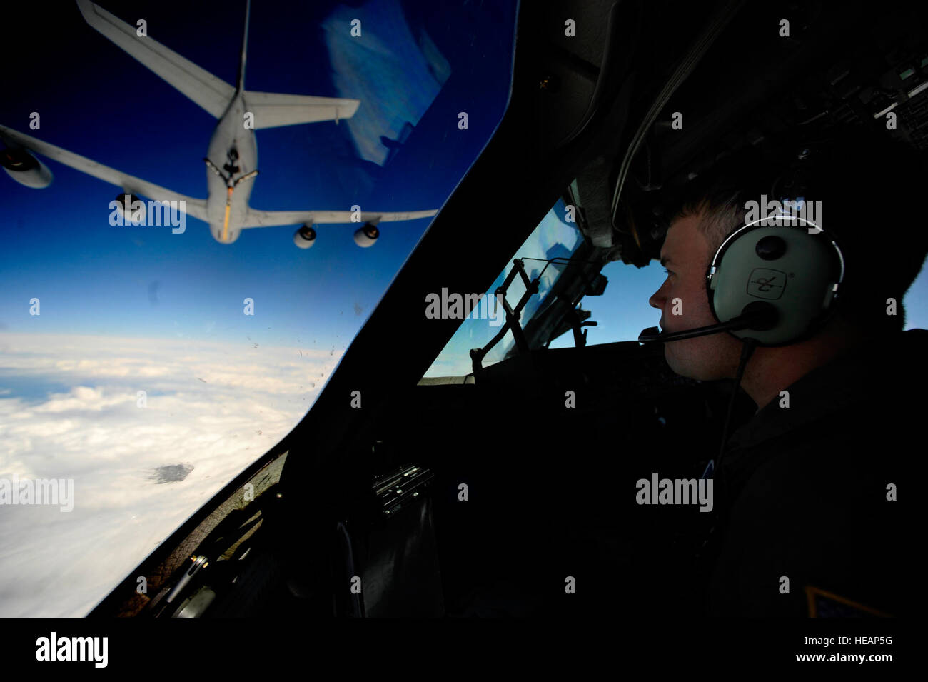 U.S. Air Force Capt. John Wicker prepares to connect to a KC-10 ...