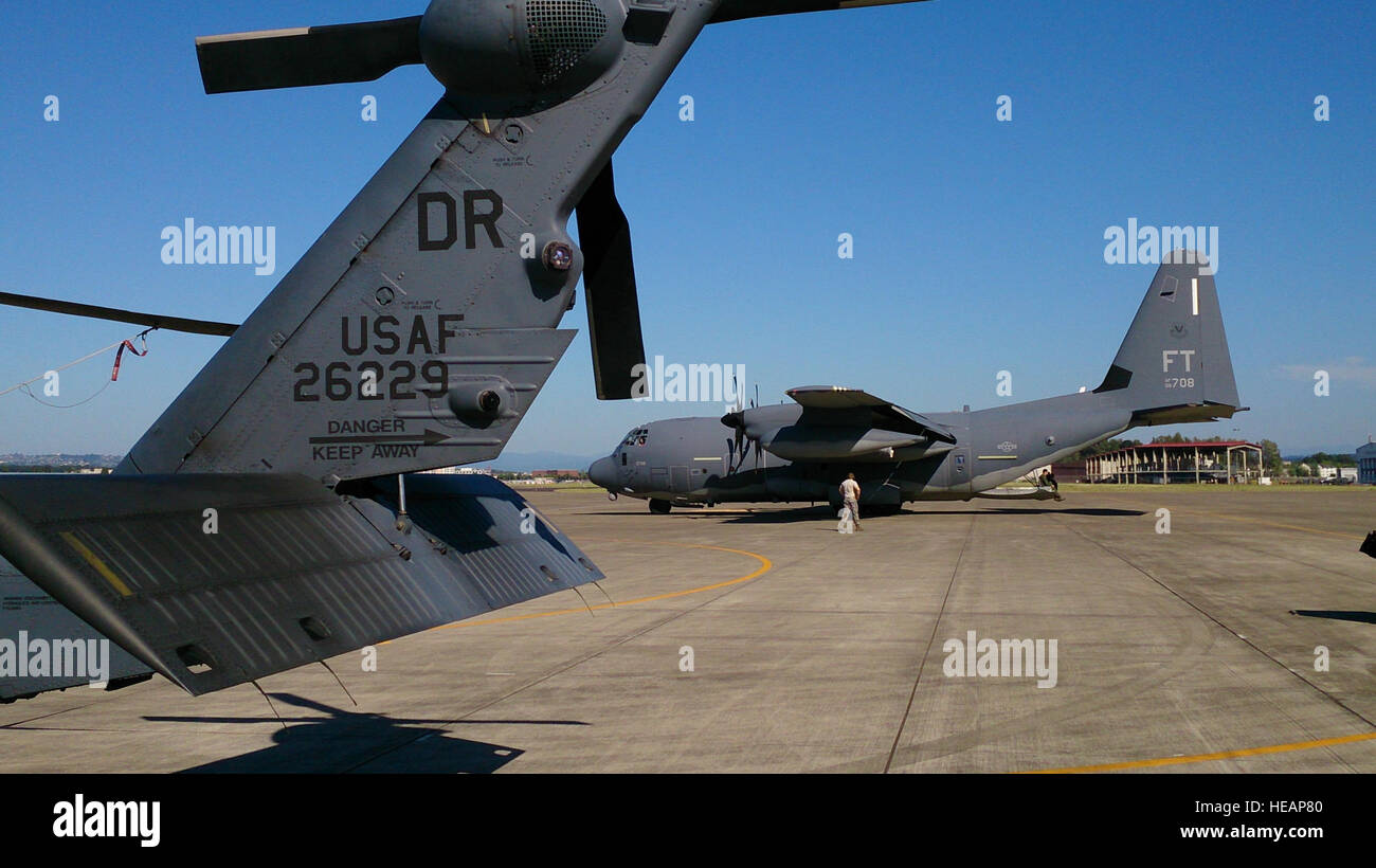 A 305th Rescue Squadron HH-60 and 79th Rescue Squadron HC-130J are ...