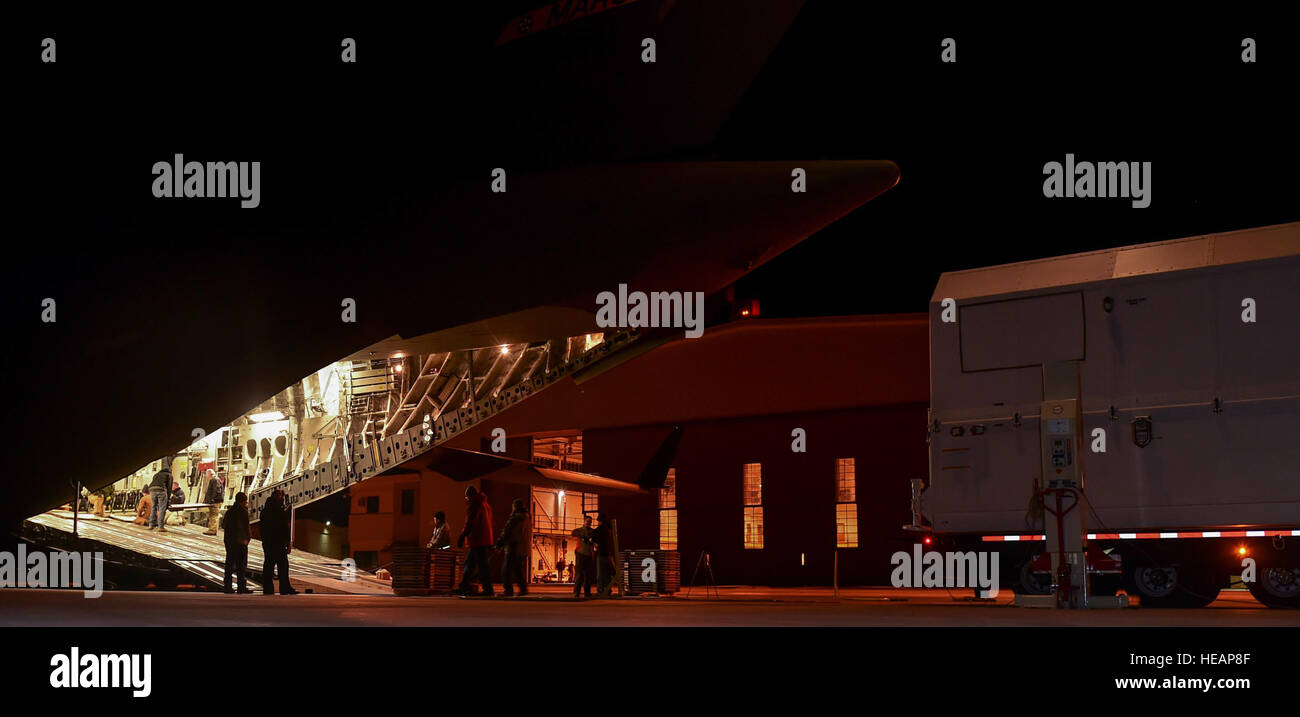 Members from Lockheed Martin prepare the loading ramp of a C-17 ...