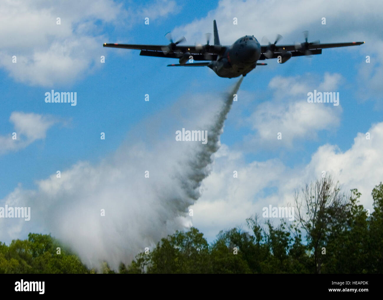 A C-130 Hercules aircraft equipped with a Modular Airborne Firefighting ...