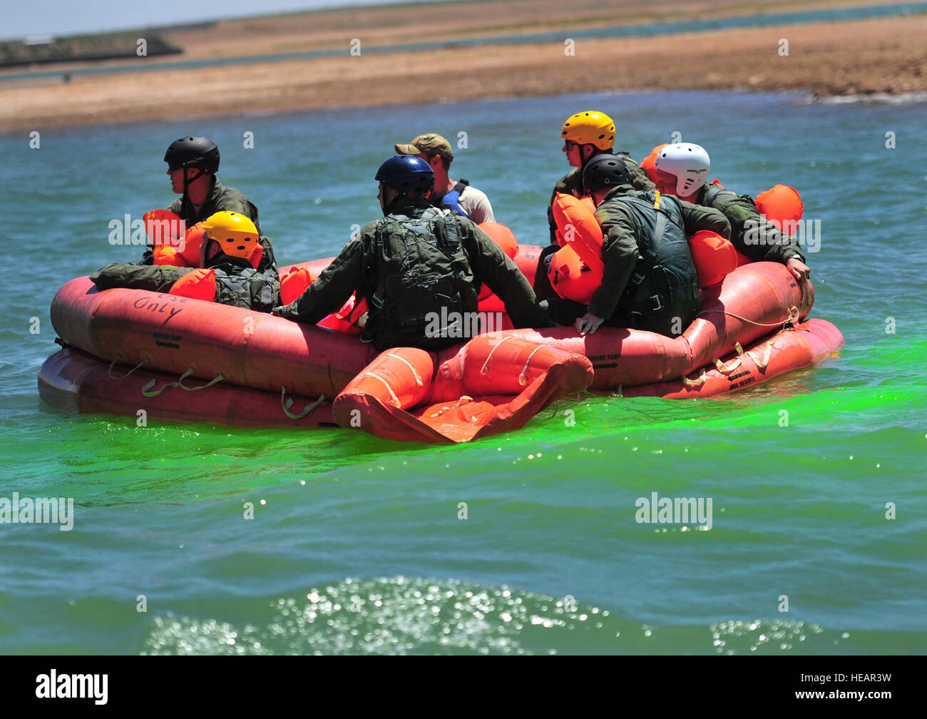 U.S. Air Force aircrew members drift in a large life raft awaiting ...
