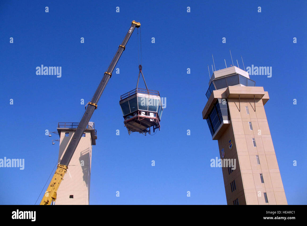 A crane removes the cab of Offutt's old air traffic control tower April ...