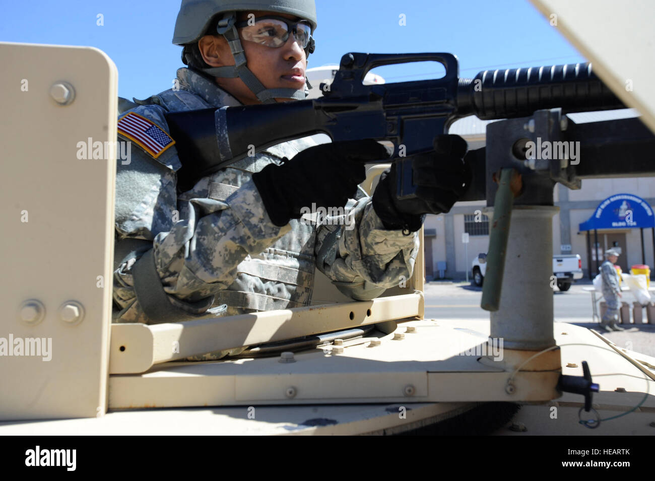 Army Staff Sgt. Adela Tacla trains in the gunner position of a Humvee ...