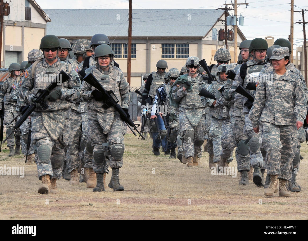 Joint service members and civilians move in formation during warrior ...