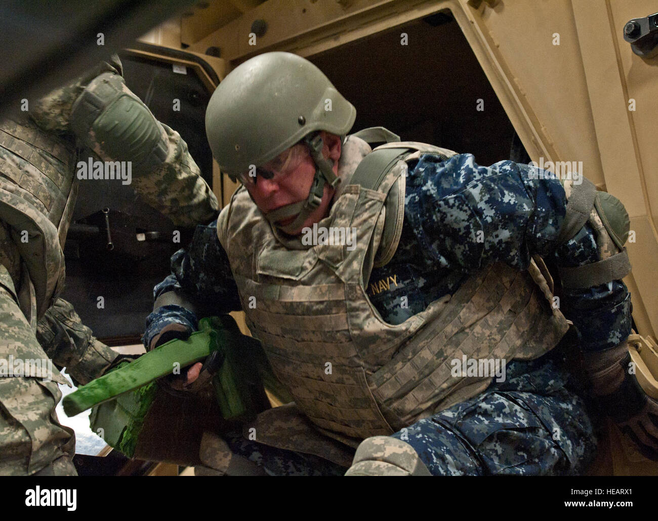 U.S. Navy Lt. John Lina dismounts a Mine-Resistant Ambush-Protected ...
