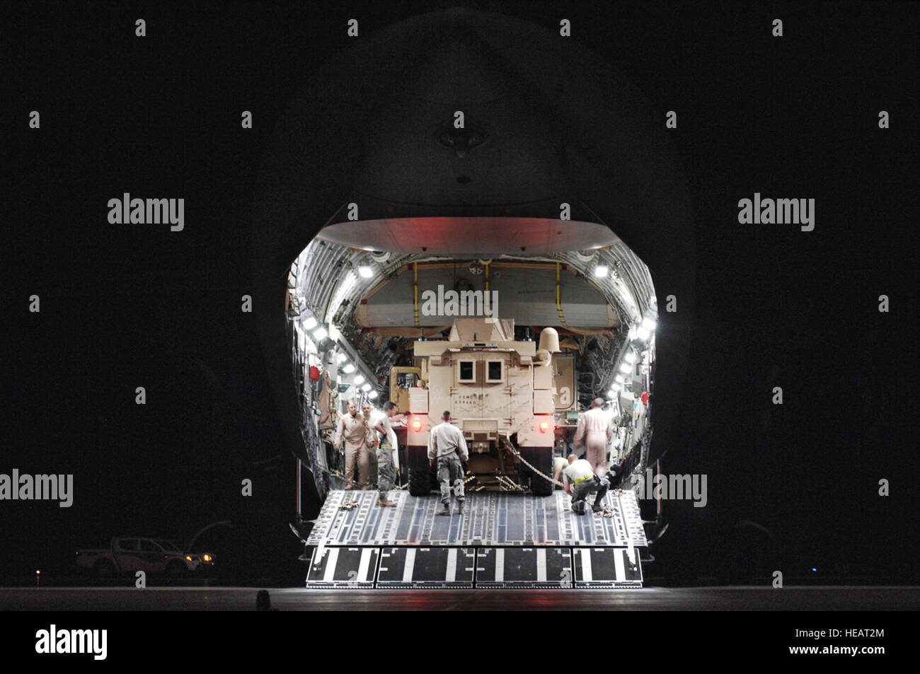 Airmen secure MRAP armored vehicles inside a Globemaster III cargo bay ...