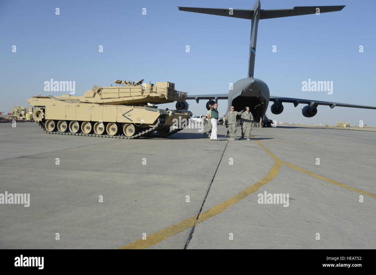 Members of the 386th Air Expeditionary Wing monitor the offload of a M1 ...