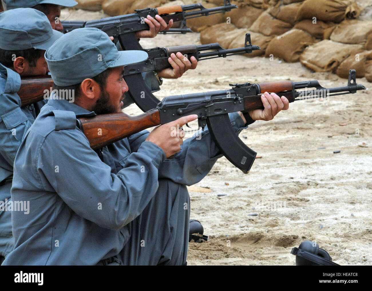 Afghan National Police trainees fire AK-47 assault rifle on the range ...
