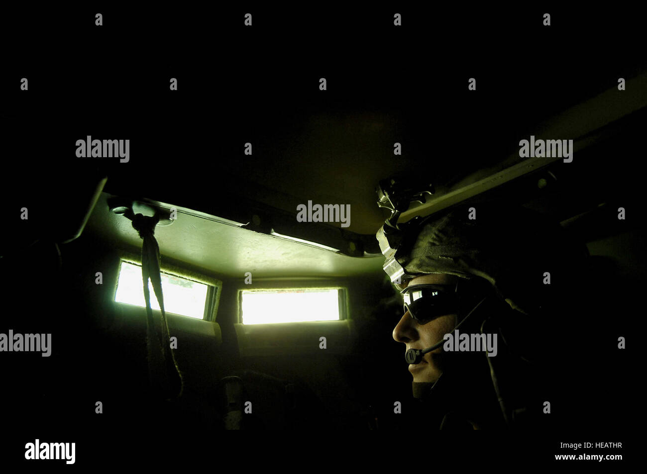 U.S. Army Spc. Corey Koonce scans his area of fire while traveling back ...