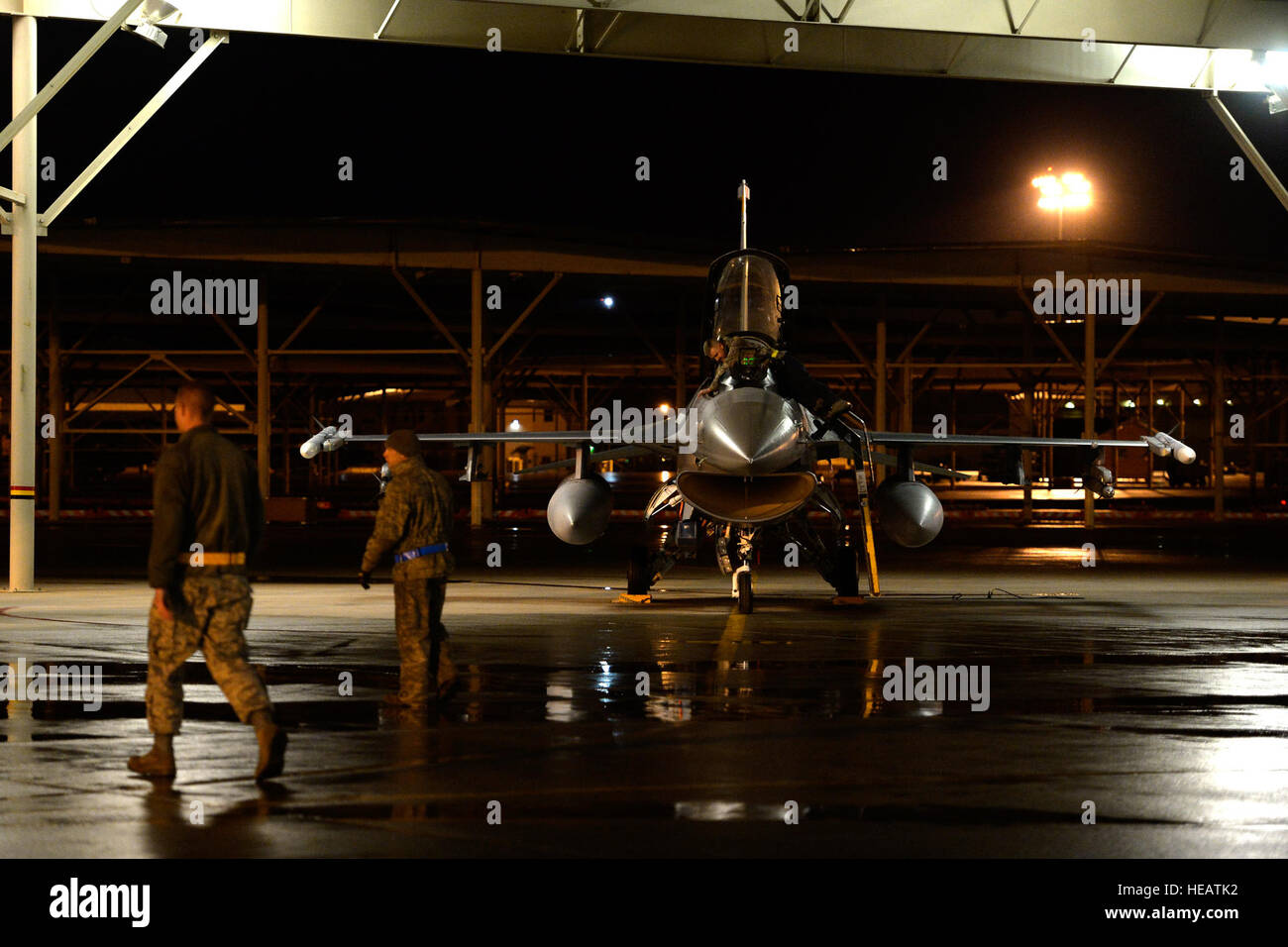 U.S. Air Force airmen of the 4th Fighter Squadron perform maintenance ...
