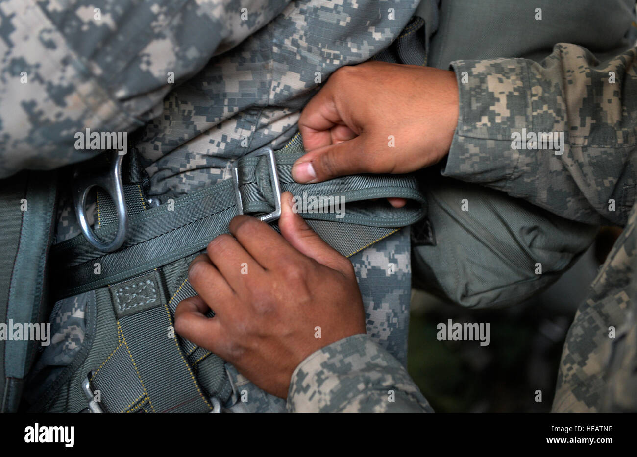 A U.S. Army jumpmaster performs a jumpmaster pre-inspection during ...