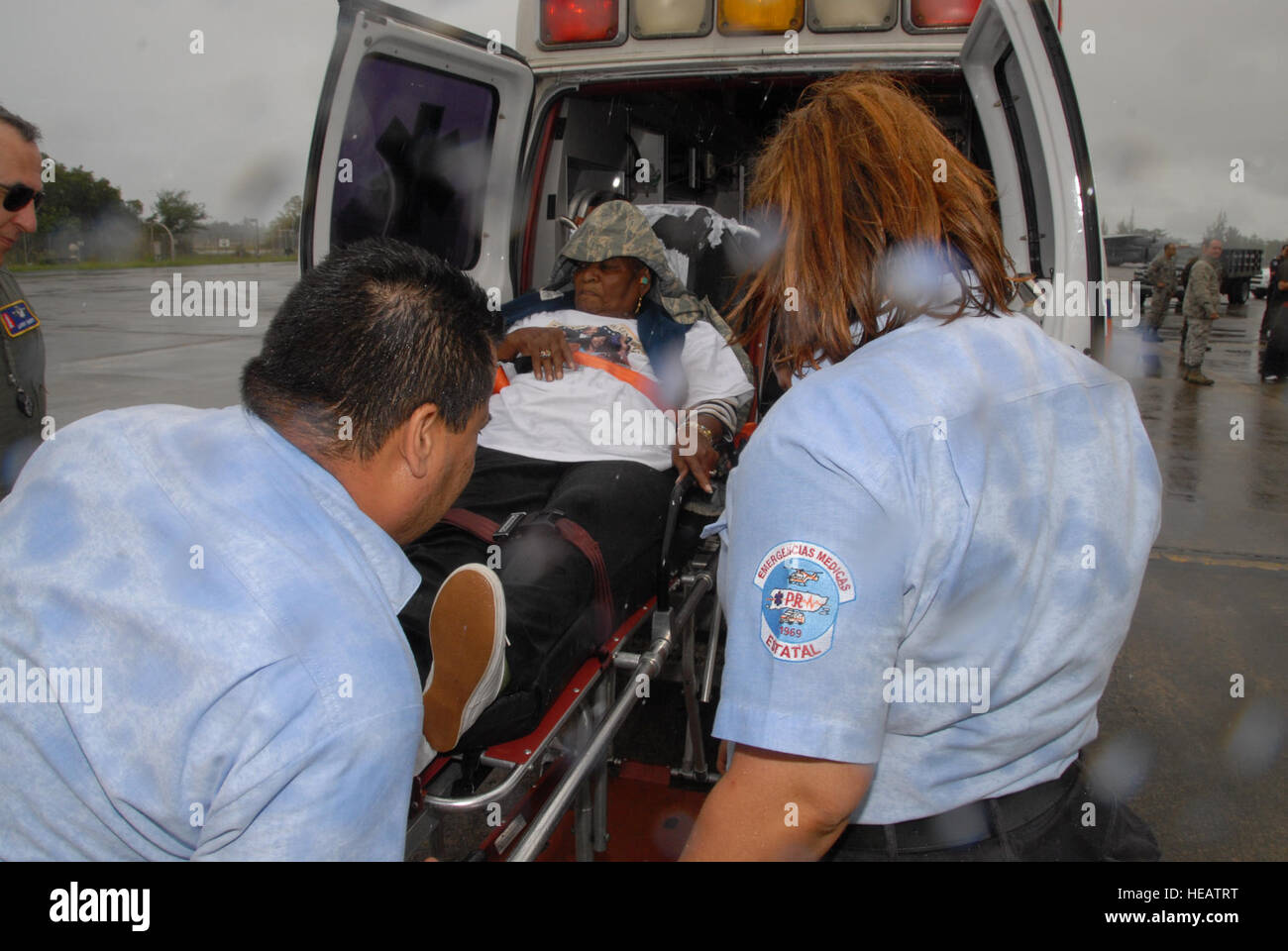 EMT's personnel transport a Haitian earthquake victim from a Puerto ...