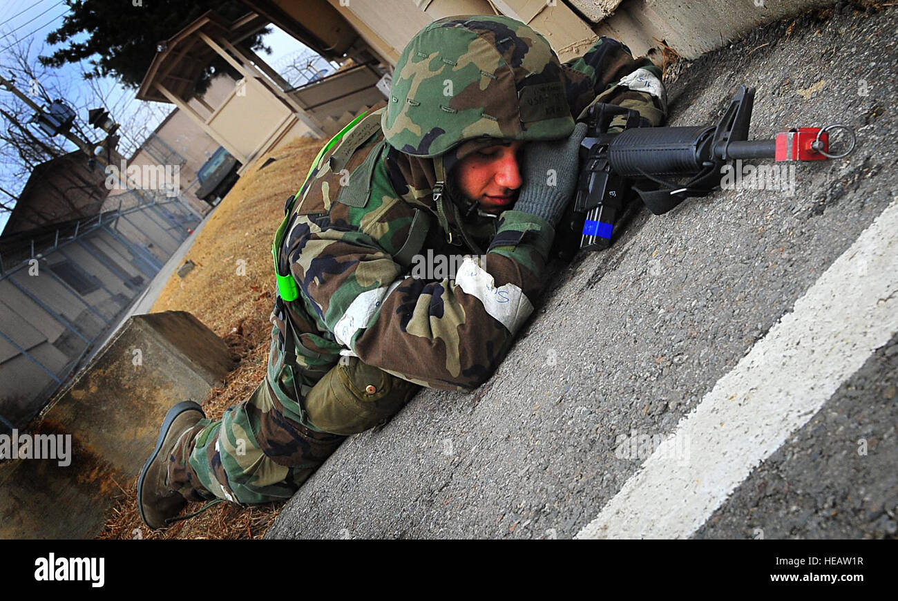 A 51st Fighter Wing Security Forces airmen secure the access point to ...