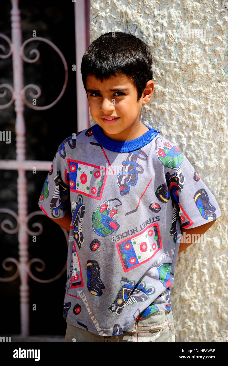An Iraqi boy watches U.S. Soldiers from the 3rd Battalion, 7th Field ...