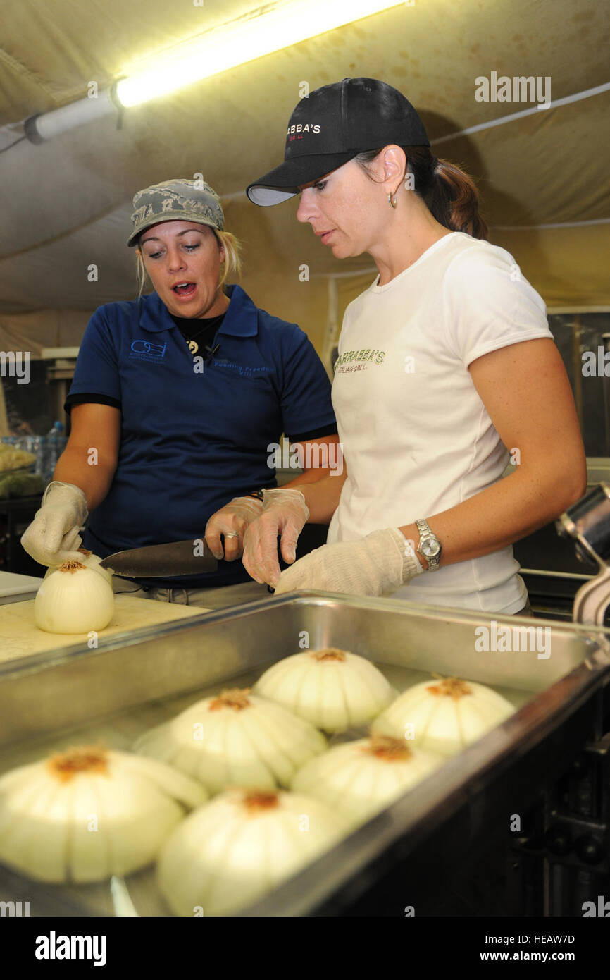 Outback Steakhouse Incorporated employees prepare onions by hand during ...