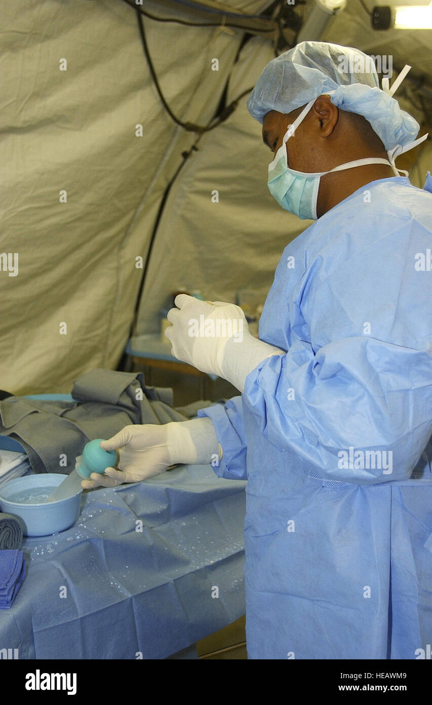 U.S. Air Force Staff Sgt. Raymond Escorido, an operating room scrub ...