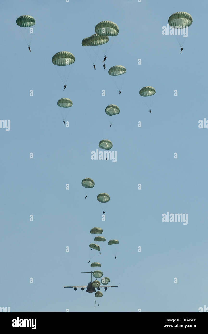 U.S. Army paratroopers from the 82nd Airborne Division jump from a C-17 ...