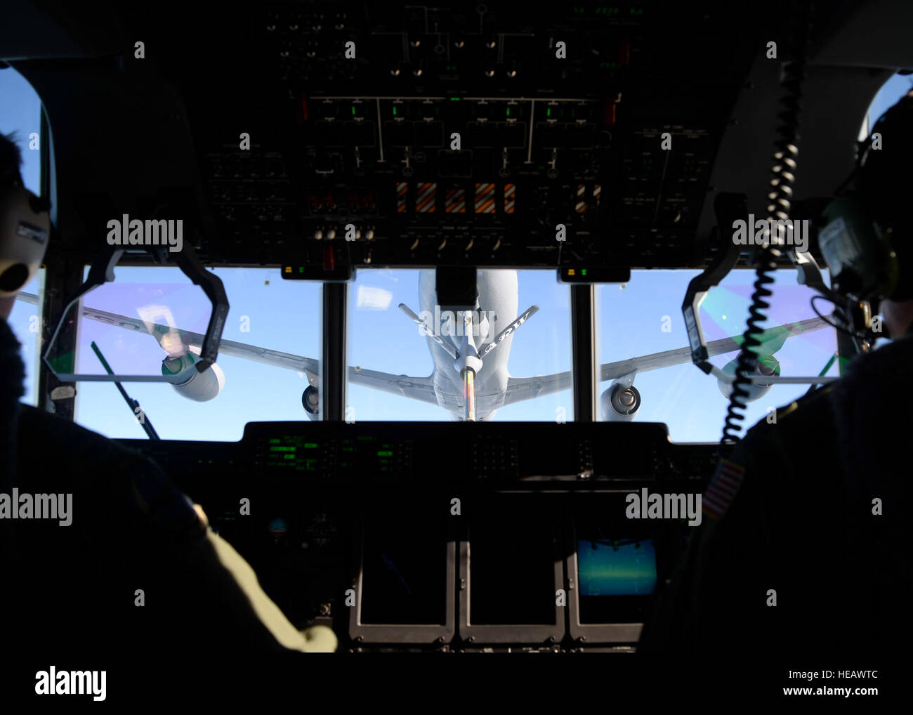 A U.S. Air Force KC-135 Stratotanker prepares to refuel an MC-130J ...