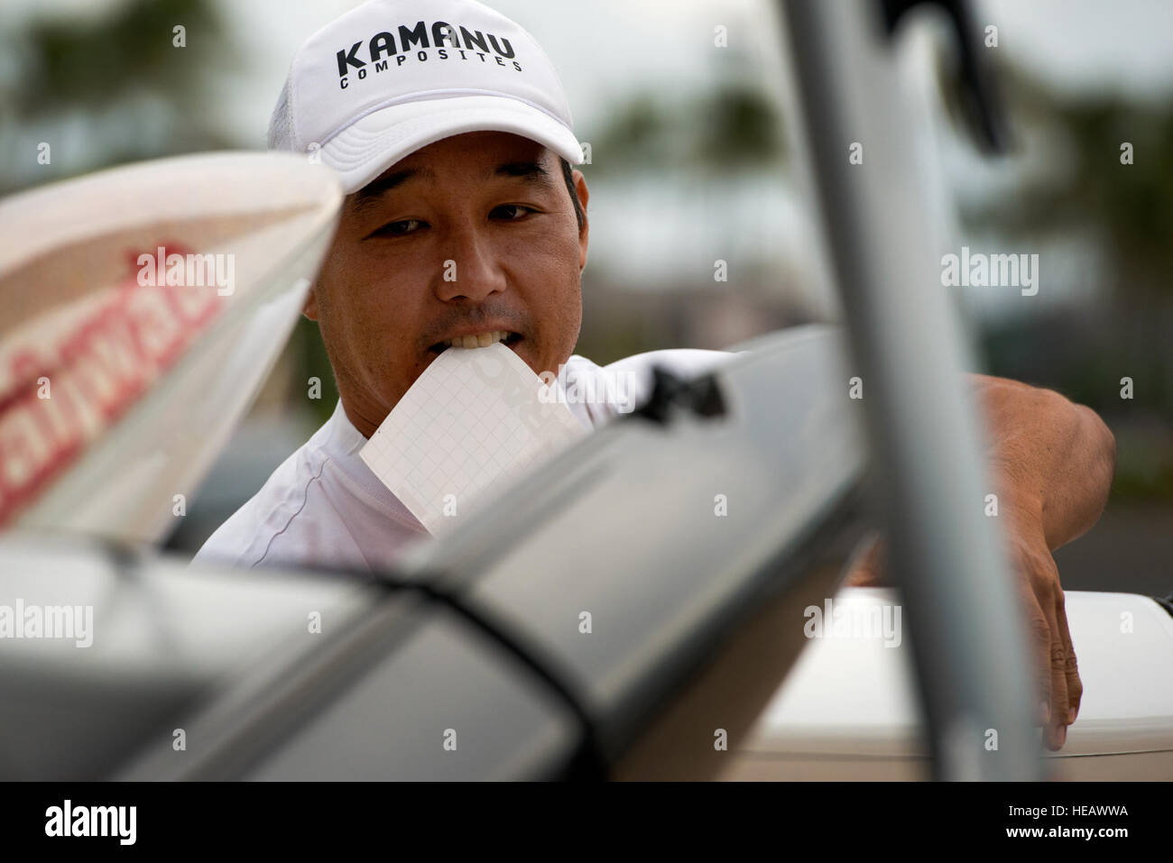 Tim Awaya, long-time canoe paddling enthusiast, unloads an ama, the ...