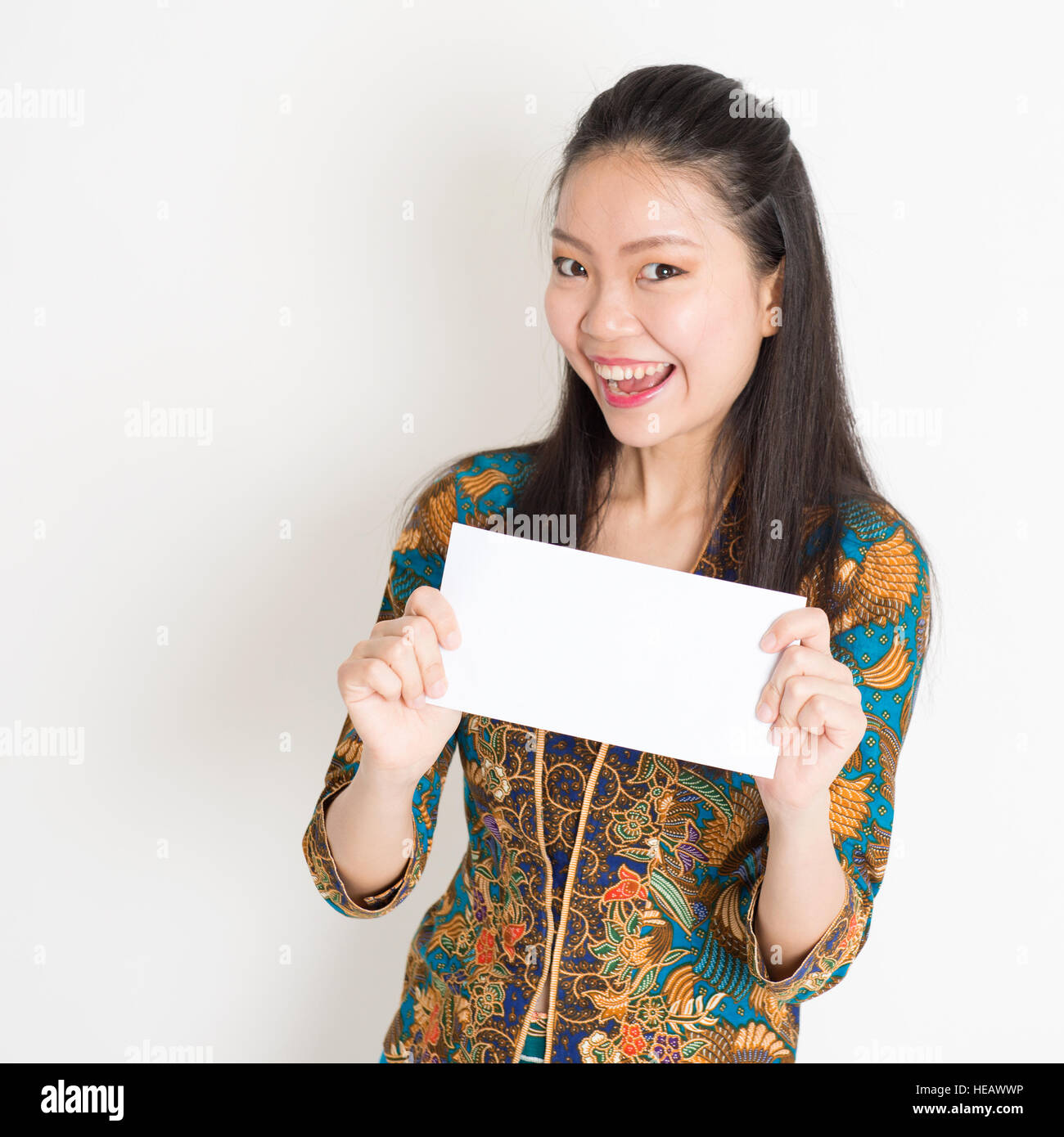 Portrait Of Young Southeast Asian Girl In Traditional Malay Batik