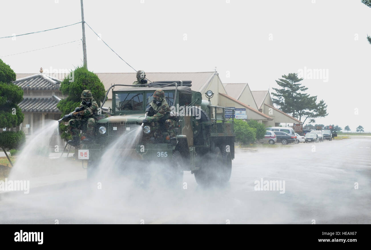 Republic of Korea Air Force members show off a decontamination vehicle ...