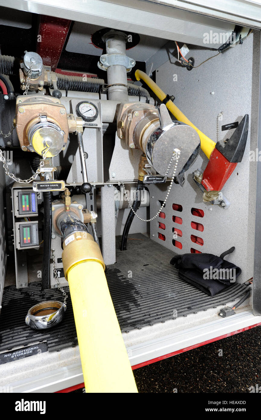 Water pumps through the system of a U.S. Air Force fire truck for ...