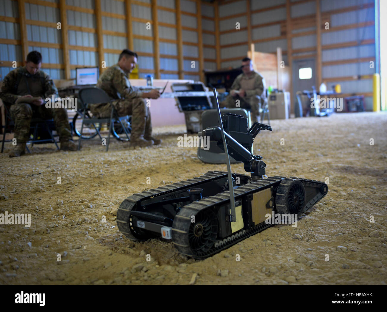 Explosive ordnance disposal airmen practice controlling robots used to ...