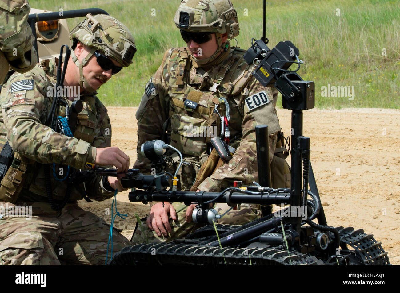 U.S. Air Force explosive ordnance disposal members prepare their robot ...