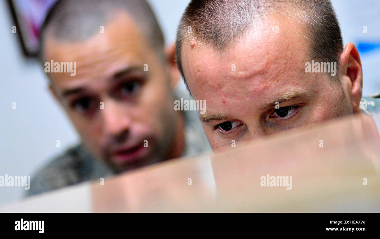 Tech. Sgt. Jeremy Fisher and Senior Airman Brandon Metz check their ...