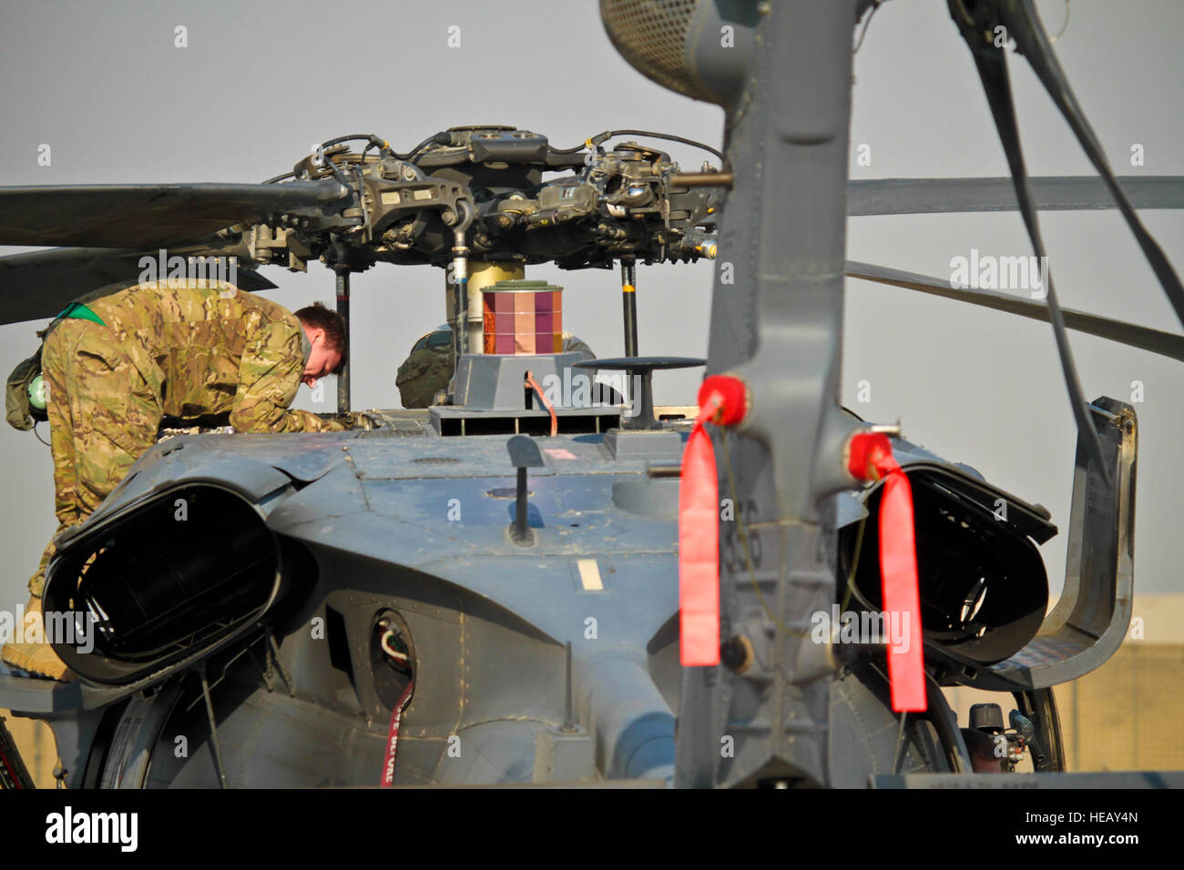 U.S. Air Force Senior Airmen Scott Shalek works on an HH-60G Pave Hawk ...