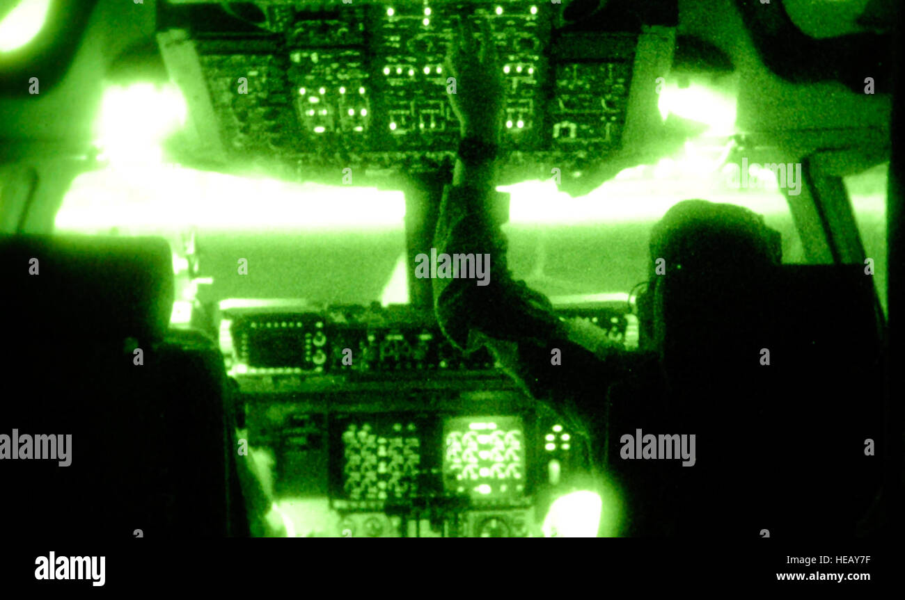 Capt. Andrew Rast, a C-17 pilot with the 17th Airlift Squadron, assists ...