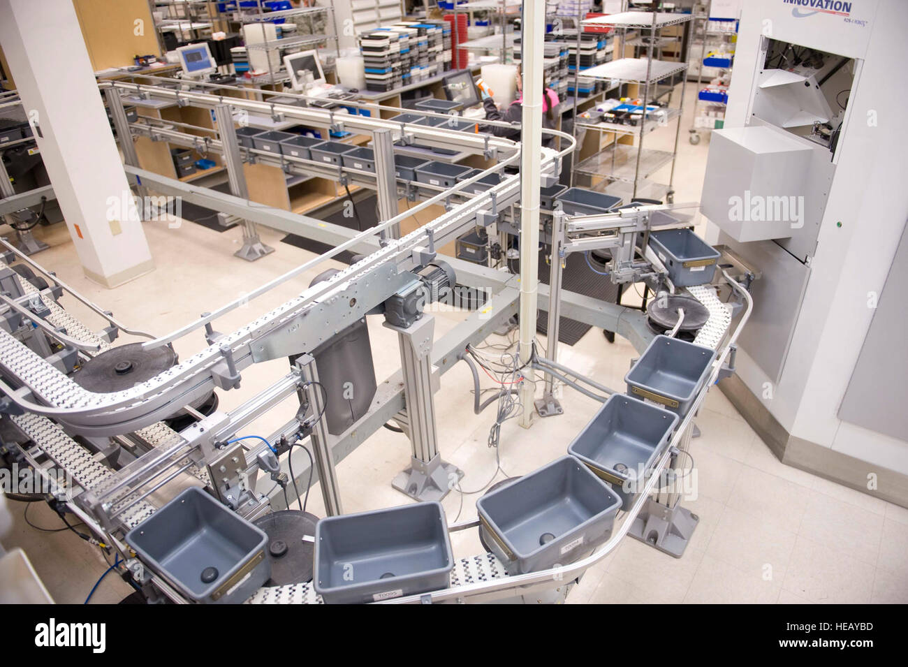 A conveyor belt begins circling manual fill stations at the satellite ...