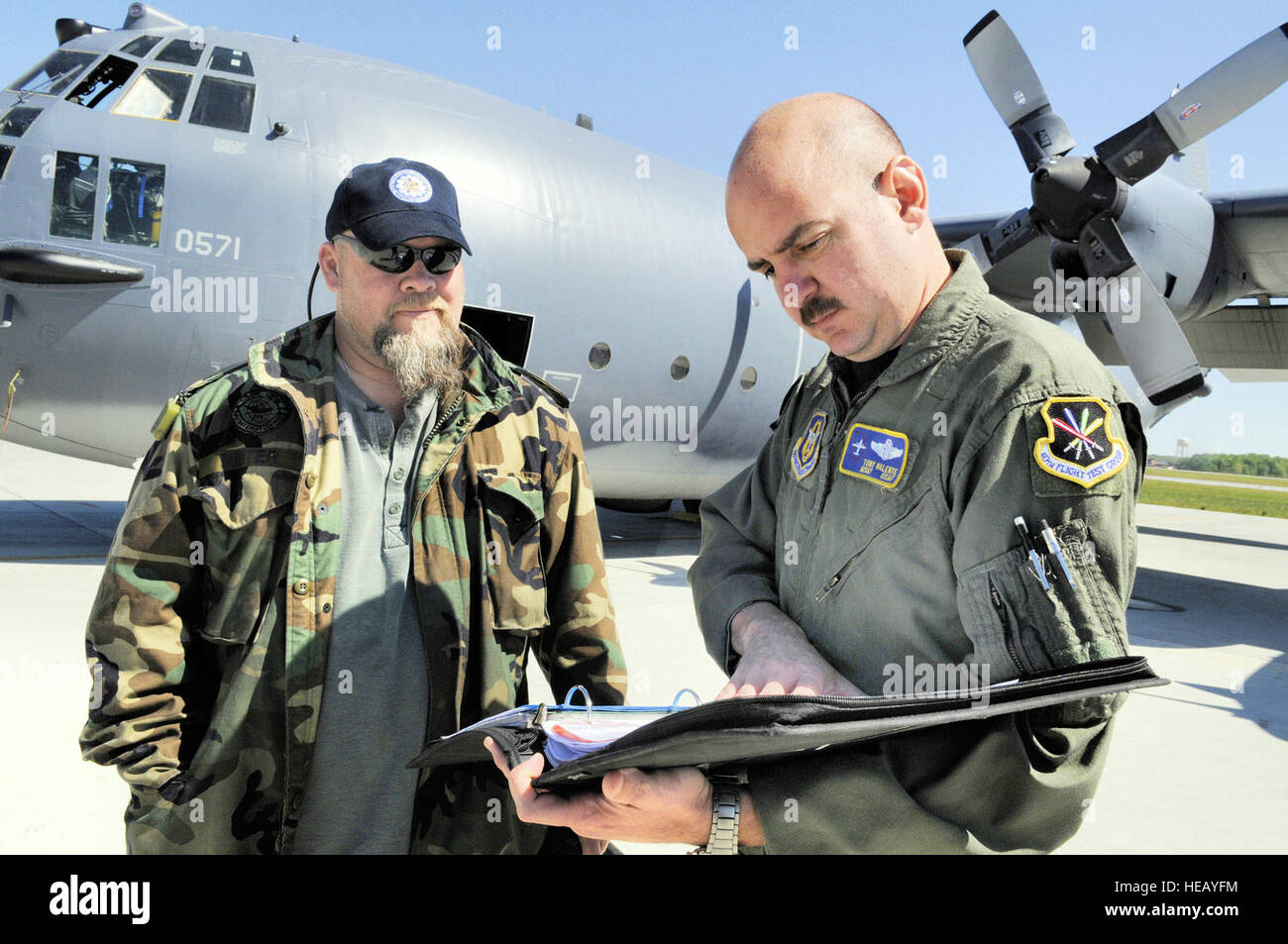 Eddie Minter, C-130 functional test work lead, mets with MSgt. Tony ...
