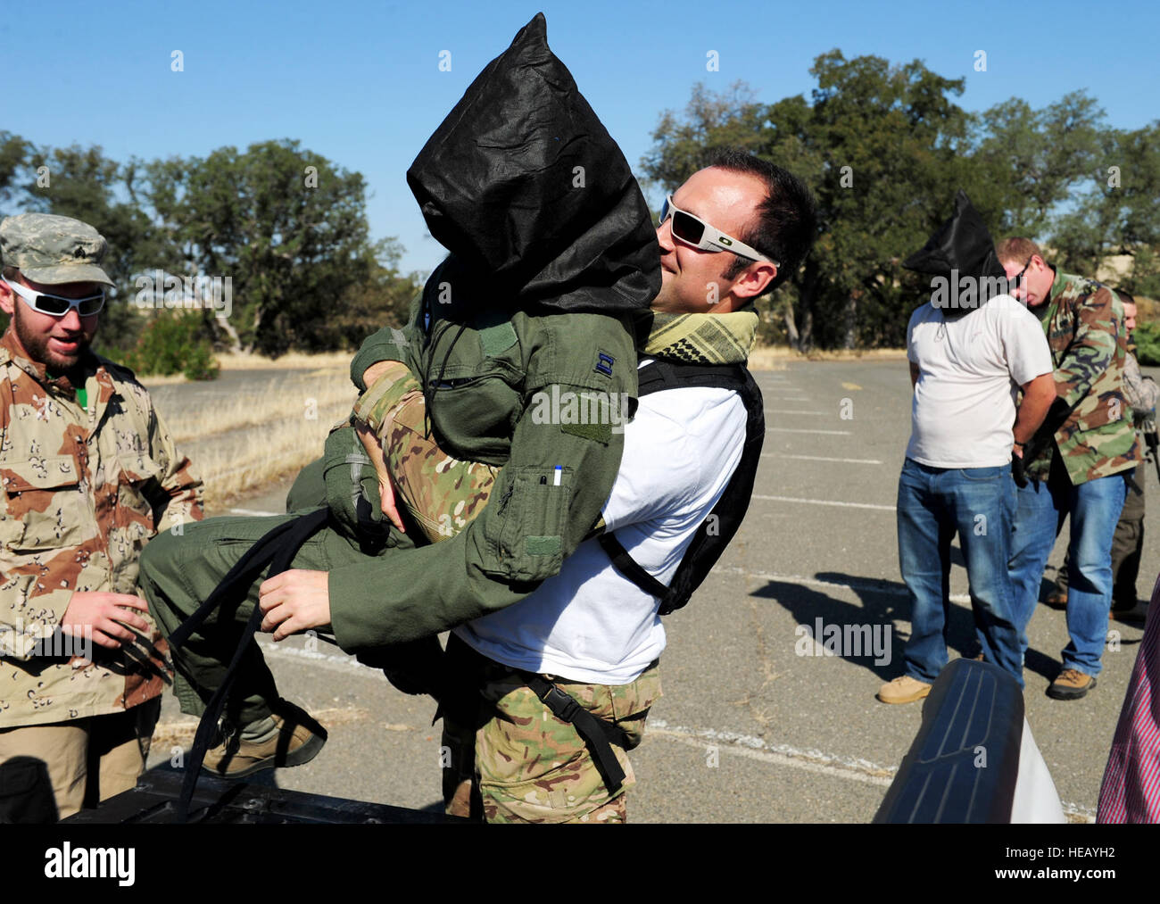 A captured pilot is loaded into a vehicle during a pilot-rescue ...