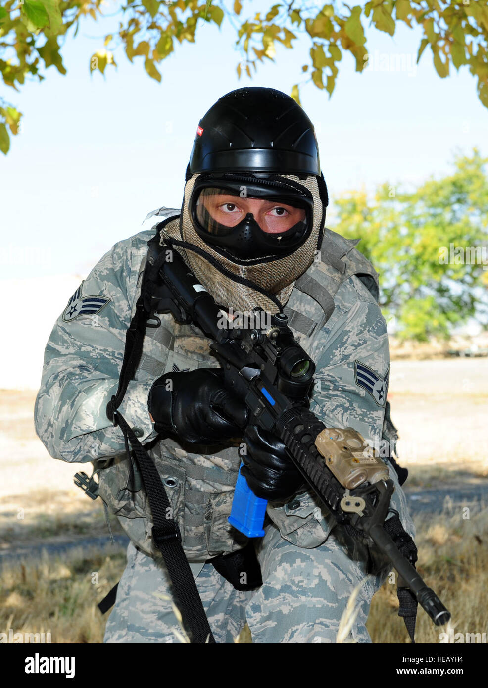 Senior Airman Jude Mares, 9th Security Forces Squadron patrolman, scans ...