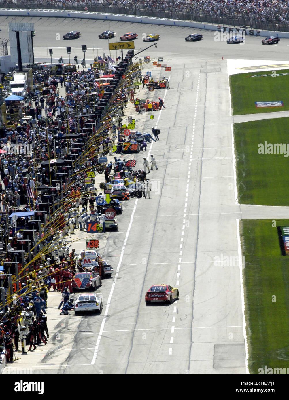 NASCAR Nextel Cup Series cars pit during the Samsung/RadioShack 500 on ...