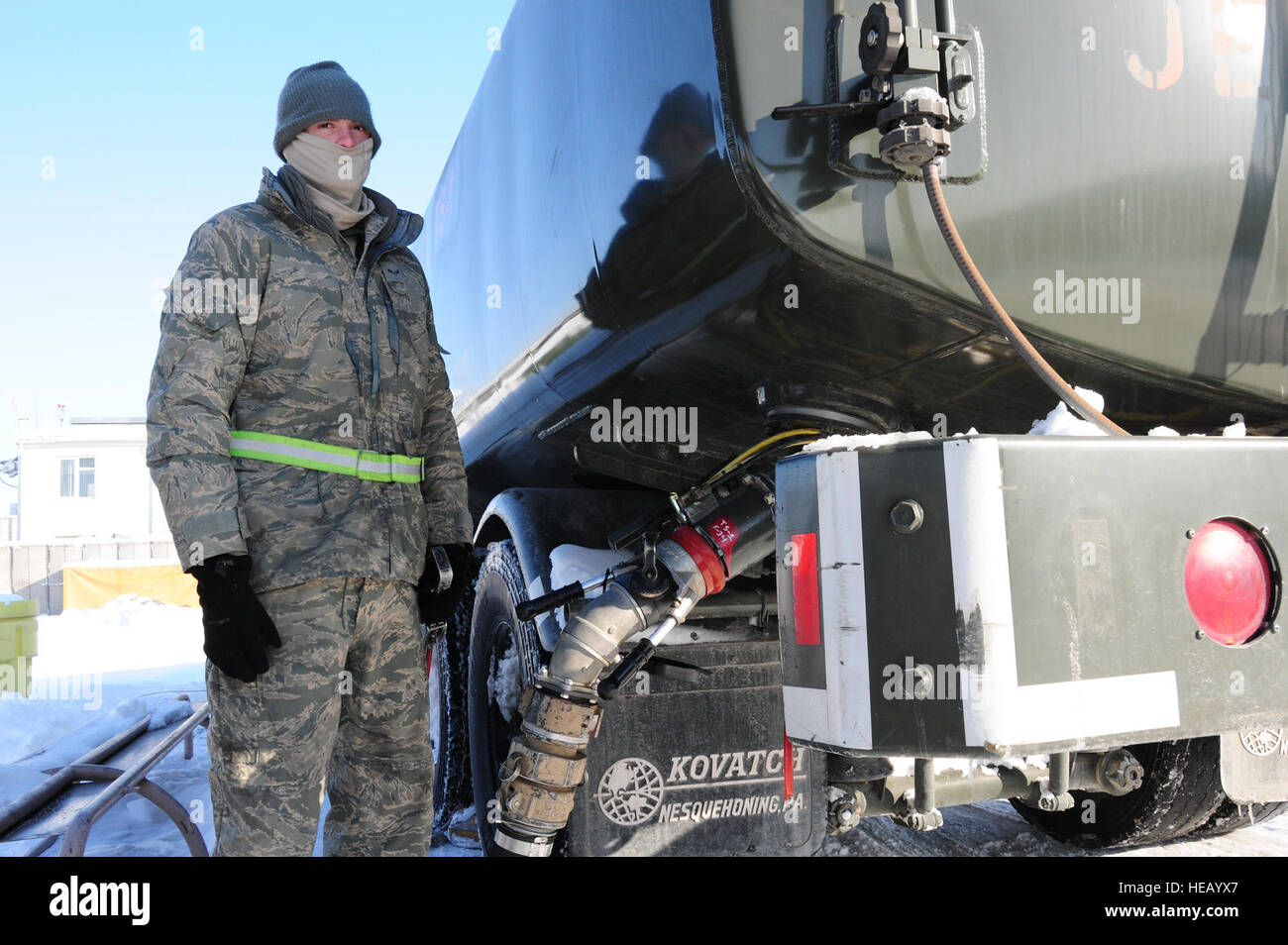 Airman 1st Class Justin Bell, pumps jet fuel into a tank to be ...