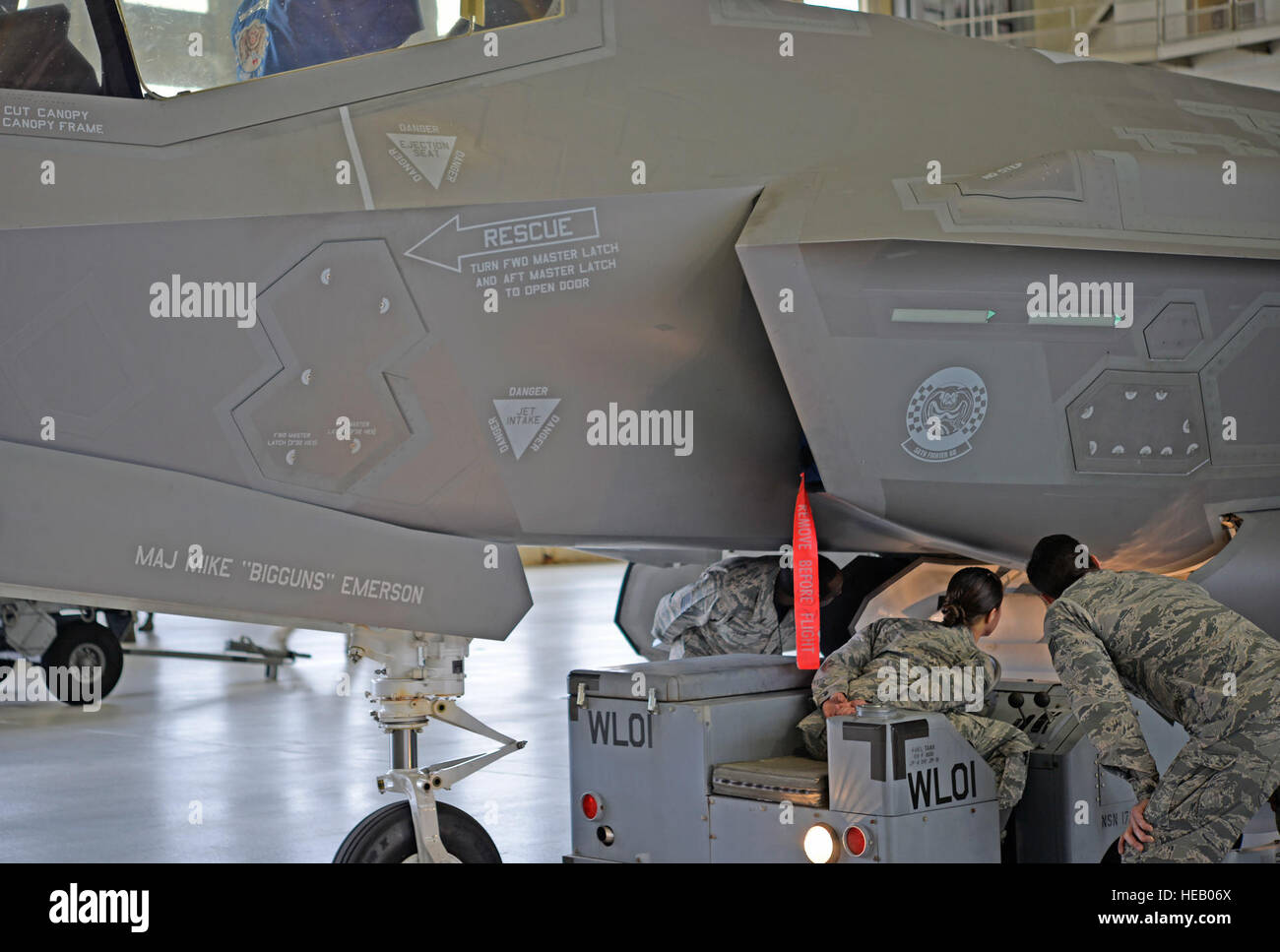 Load crew members from the 33rd Fighter Wing and judges watch as a ...