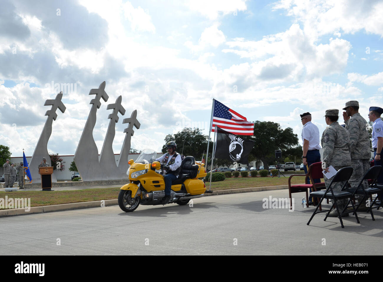 One of the Patriot Guard motorcycle riders leads a roll by to welcome ...