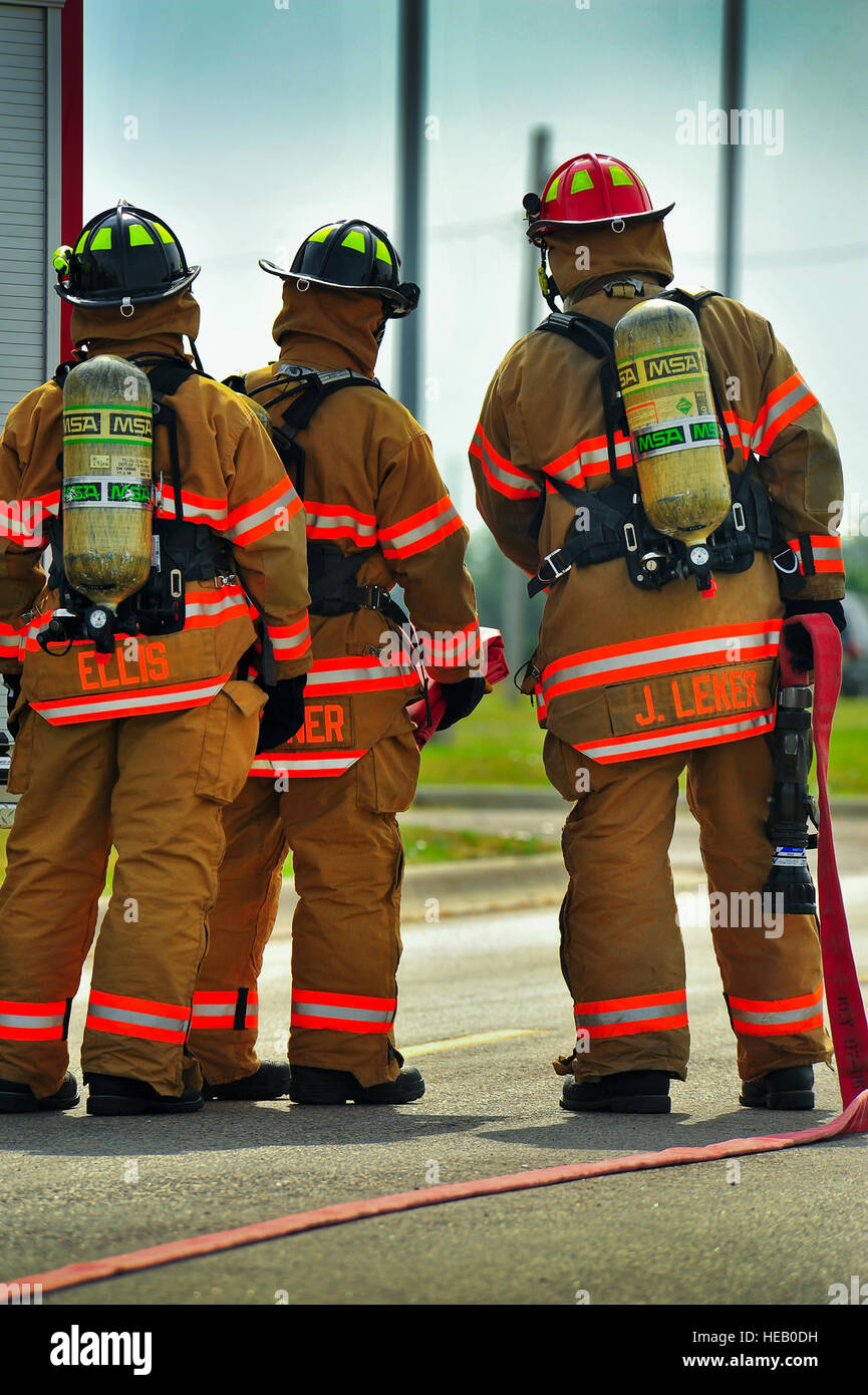 Fire fighters from the 5th Civil Engineer Squadron participate in an ...