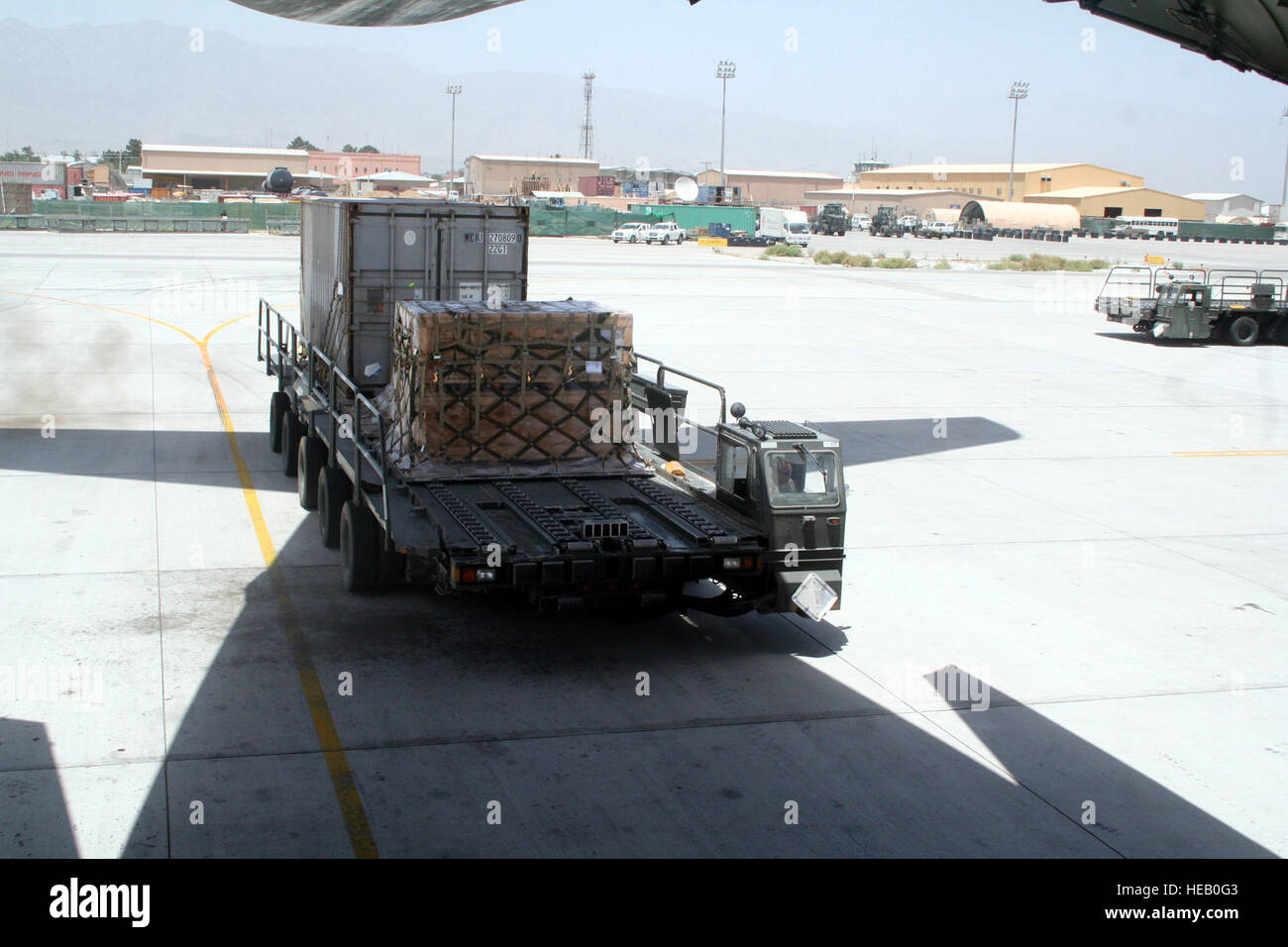 Air transportation airmen off-load cargo from a C-5M Super Galaxy from ...