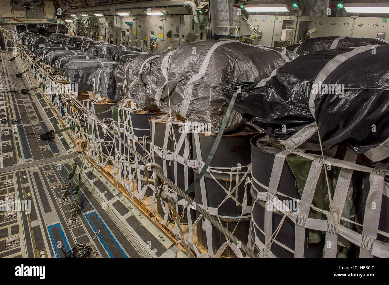 Pallets filled with supplies on a C-17 Globemaster III are prepared for ...