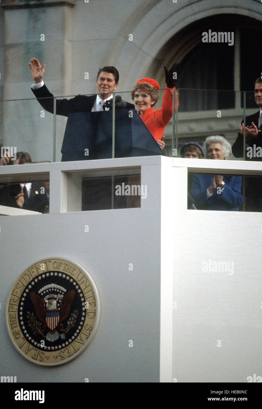 President and Mrs. Ronald Reagan wave to the crowd listening to the ...